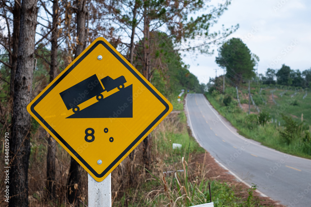 Traffic signs warning up to hill steep road sign to slope a steep climb ...