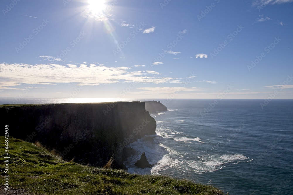 Breathtaking scenery of ocean waves crashing into cliffs of Moher ...