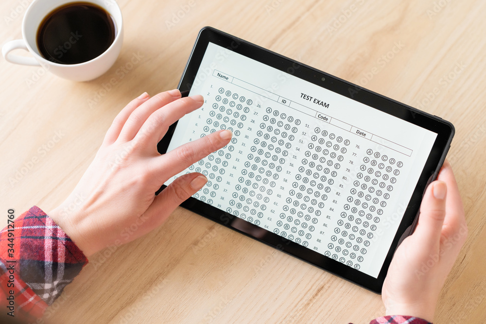 Fotka „Online exam. girl student testing exercise. Examination test on ...