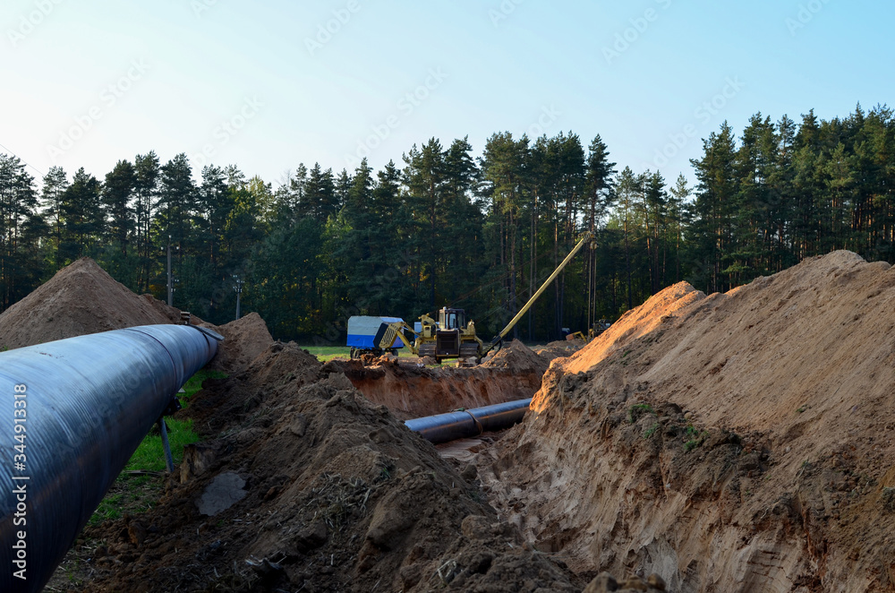 Natural gas pipeline construction work. A dug trench in the ground for ...