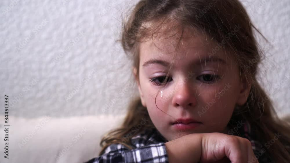 Little girl crying. Tears on face of child. Scared, sad and unhappy ...