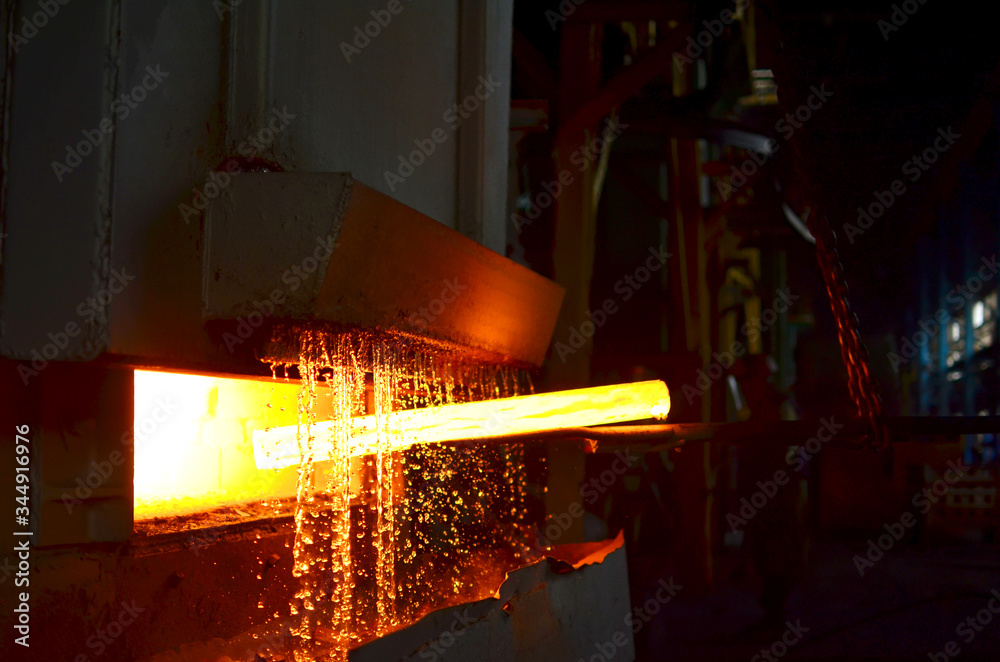 Foto de Steel quenching at high temperature in industrial furnace at ...