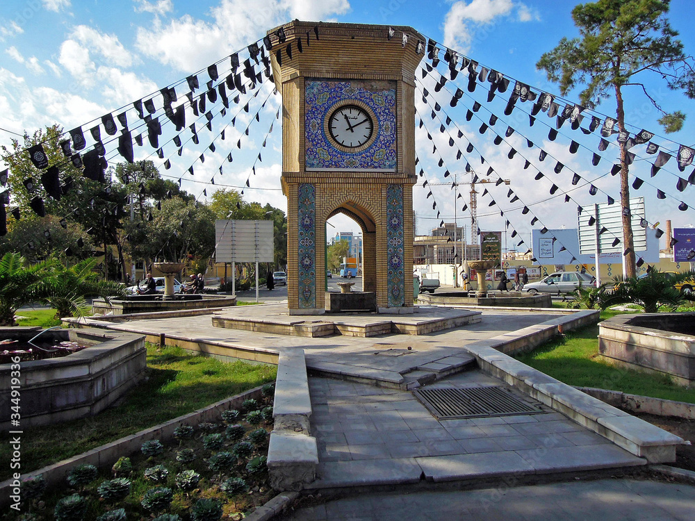 Street panorama of Kashan, Iran. Clock tower standing on the central ...