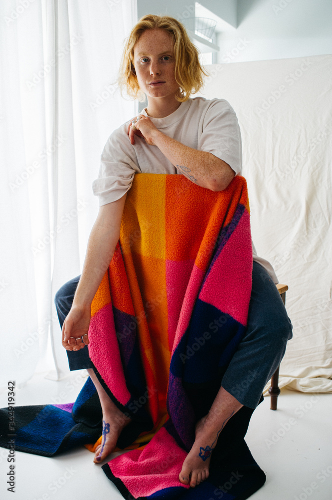 Generation Y Natural Beauty Fashion Model On A Chair At Home Stock ...