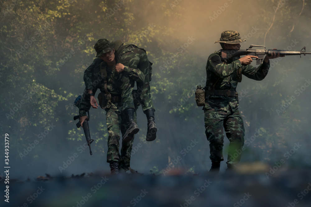 army soldier with rifle and machine gun moving .Thai army soldier in ...