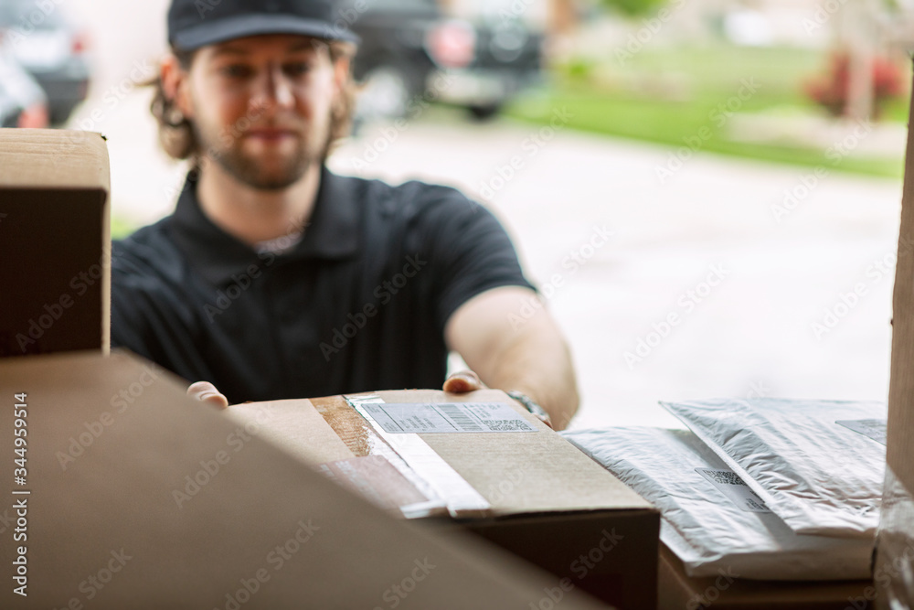 Shipment: Man Getting Boxes Out Of Delivery Van Stock Photo | Adobe Stock