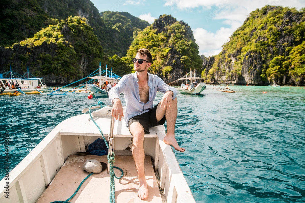 male model floating amidst rock islands in coron philippines Stock ...