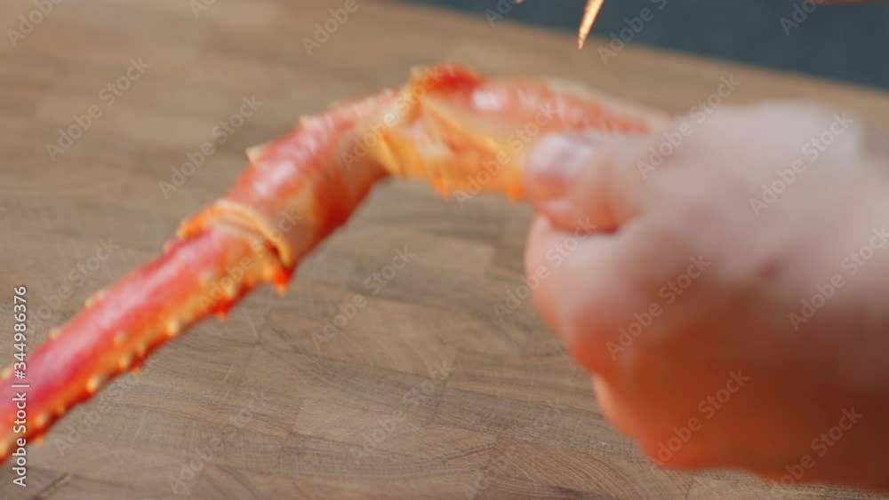Man breaks the legs of Norwegian Red King Crab Chef parses processed ...