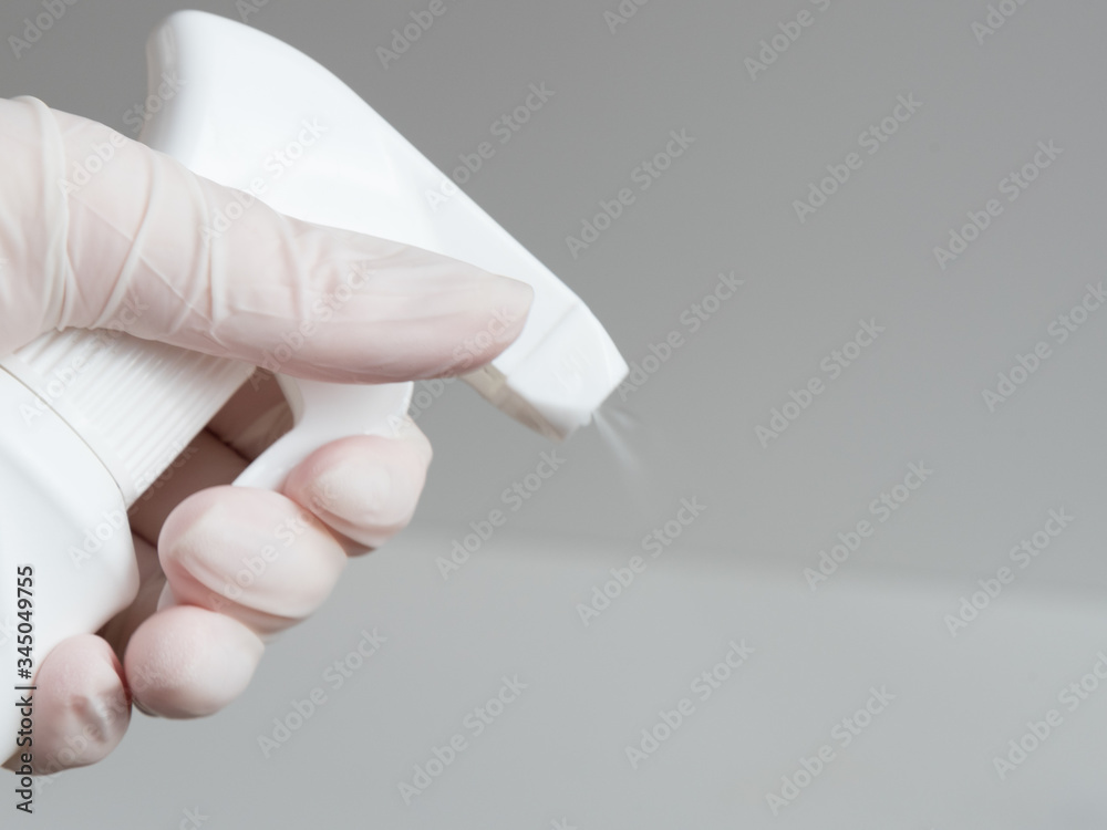 Spraying an antibacterial disinfectant spray. Dispenser of disinfectant ...