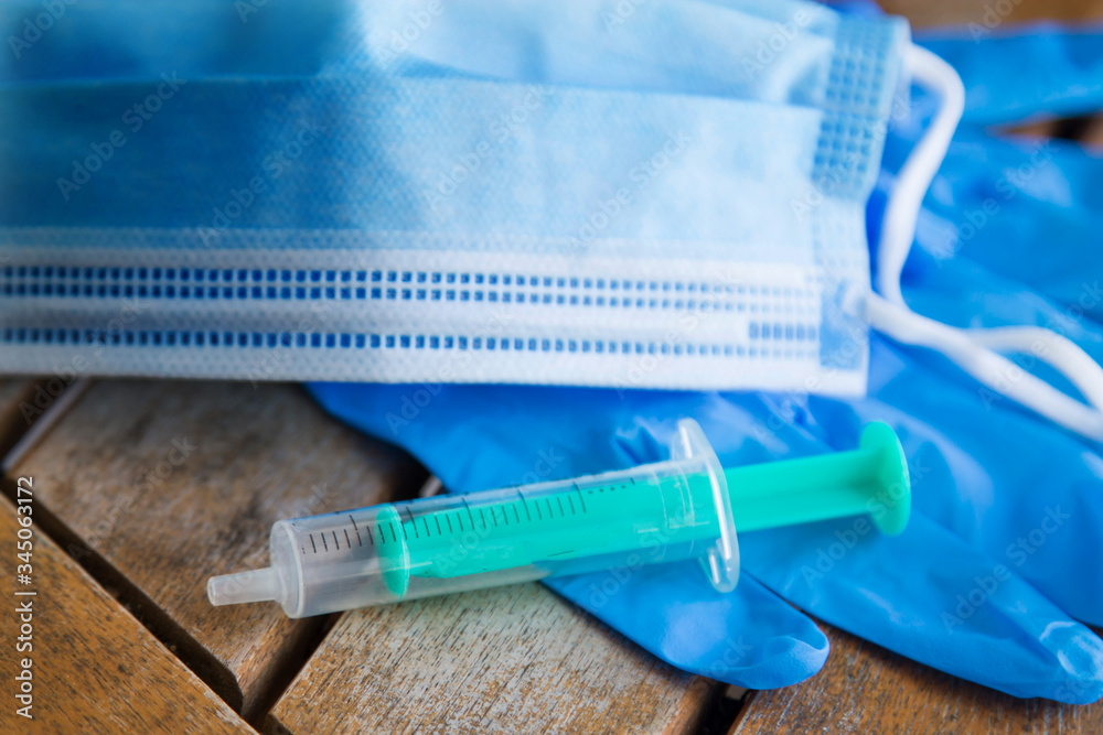 mask, syringe and surgical gloves isolated, prevention against viruses ...