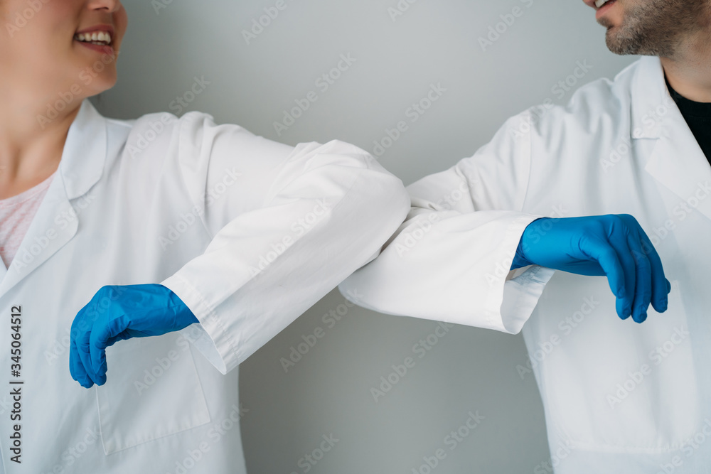 Elbow bumping. A new way of greeting to prevent the spread of the ...