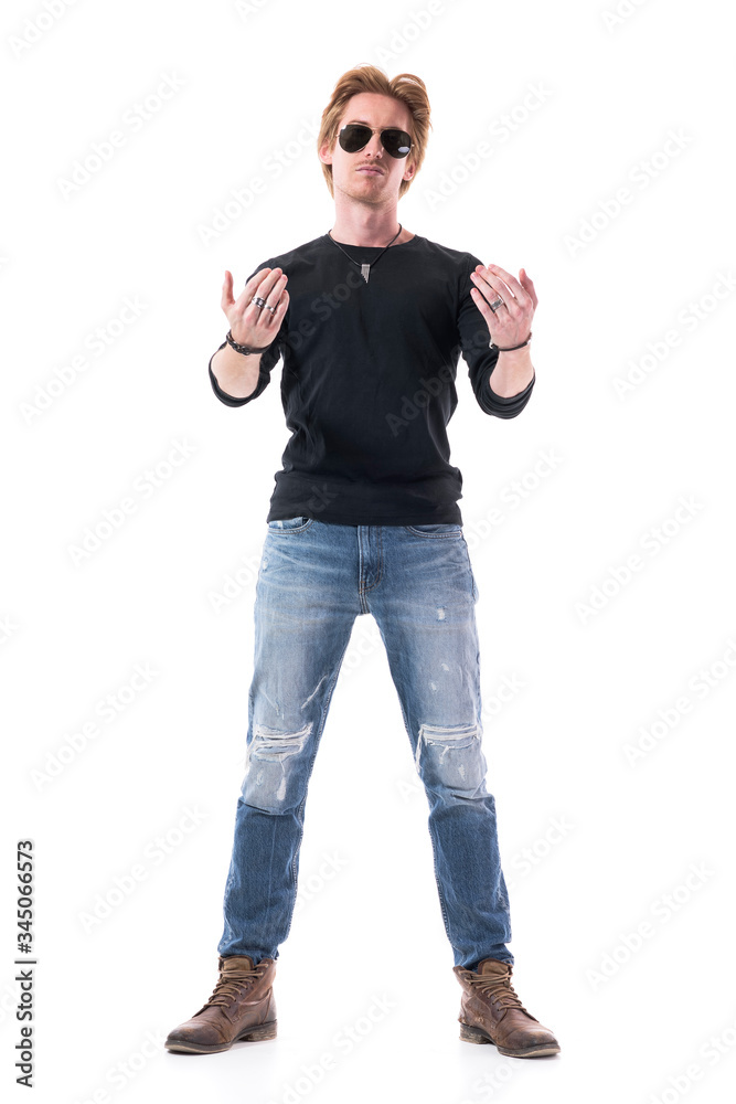 Cocky young handsome man with daring attitude provoking and beckoning ...