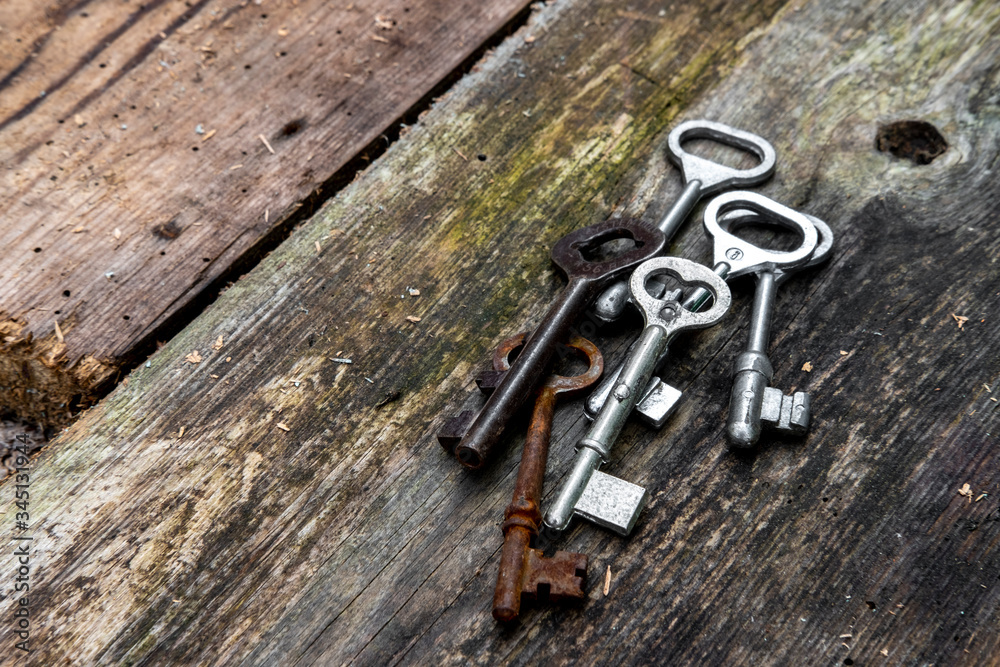 Old keys of different sizes on rustic weathered wood planks Stock Photo ...