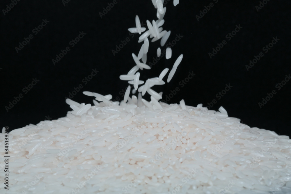 Rice Grains Falling on a pile Macro Stock Photo | Adobe Stock
