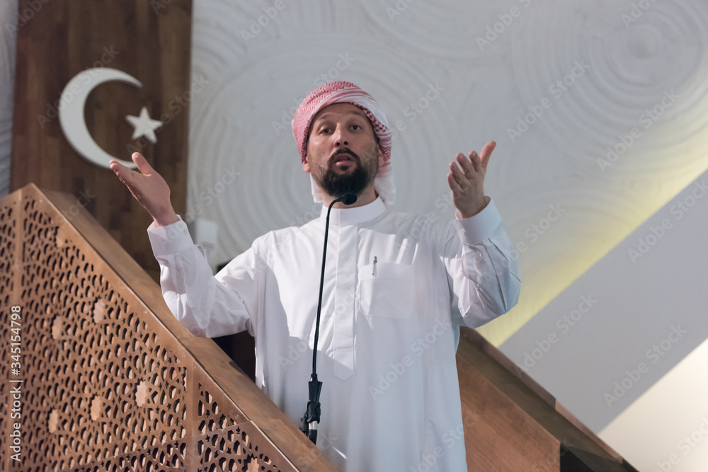 Muslims young arabic Imam has a speech on friday afternoon prayer in ...