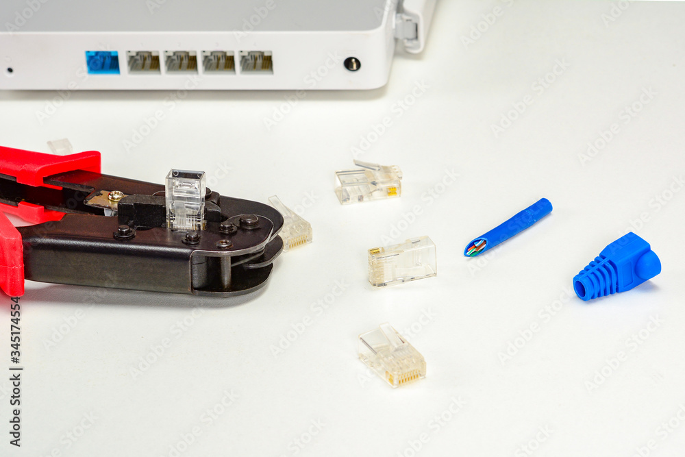 Crimping tool, internet Wi-Fi router, RJ45 connectors, blue boot for rj ...