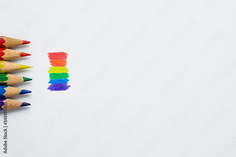 Rainbow drawn with colorful pencils on white background with copy space ...