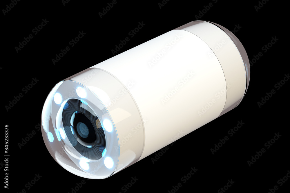 Capsule size camera for endoscopy isolated on black background. The ...
