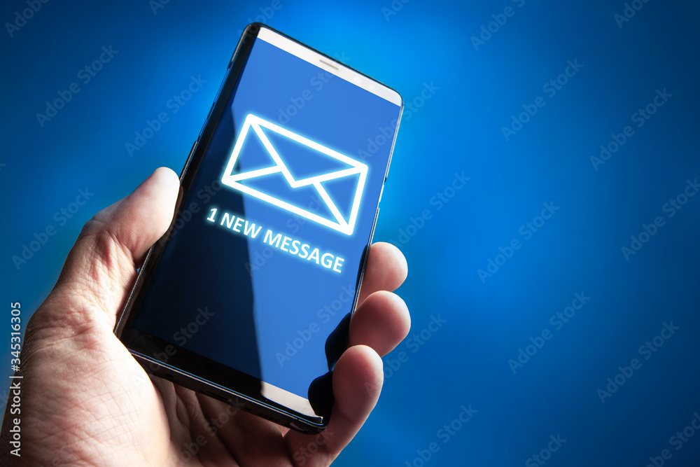 1 new message. Phone in the hand of a man. Concept - man received an SMS message. Human received ...