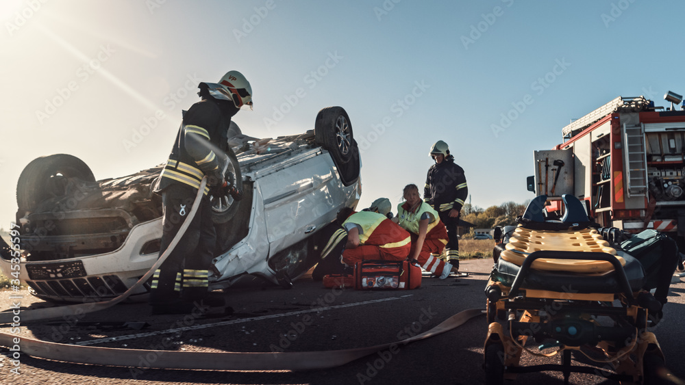 On the Car Crash Traffic Accident Scene: Team of Paramedics and ...