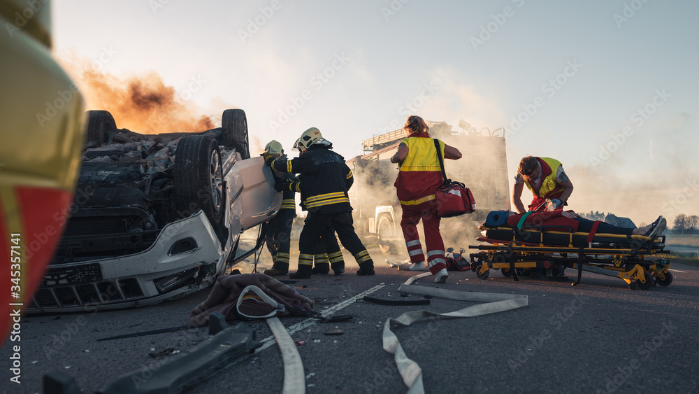 Paramedics and Firefighters Arrive On the Car Crash Traffic Accident Scene. Professionals Rescue ...