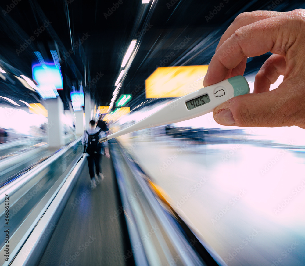 Hand holding thermometer with high temperature with zoom blur effect in ...