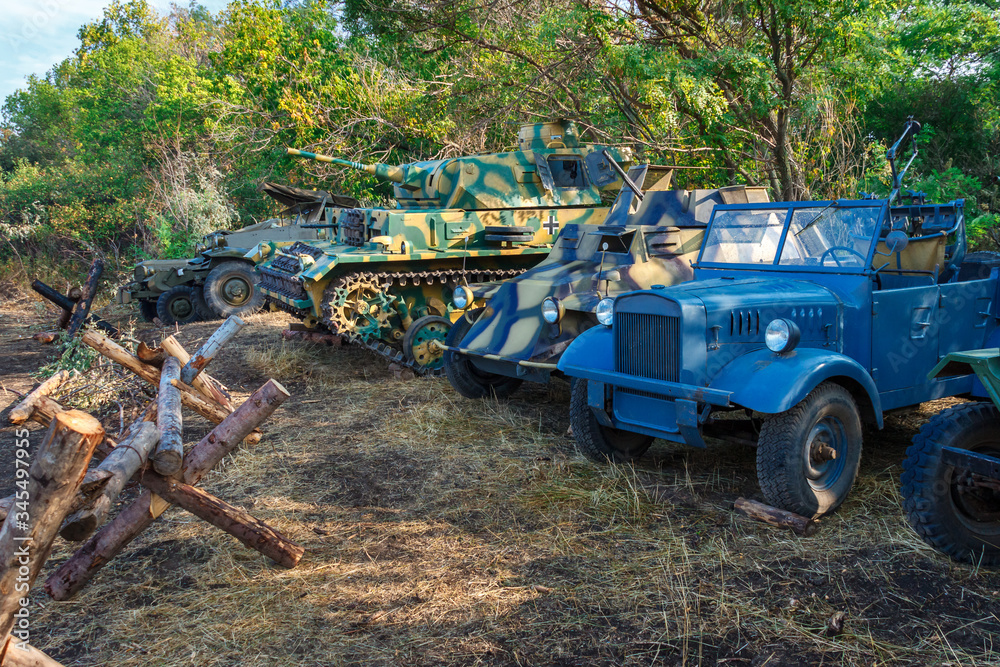 A german world war II military equipment in a forest - 4x4 car Stoewer ...