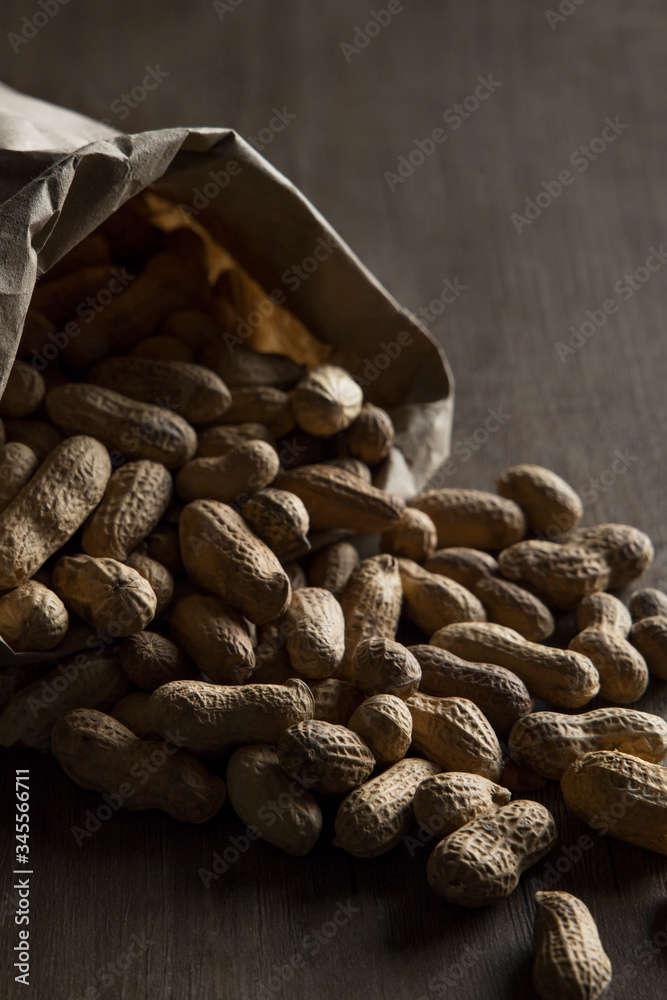 Roasted groundnuts falling out of a brown paper bag. Stock Photo ...