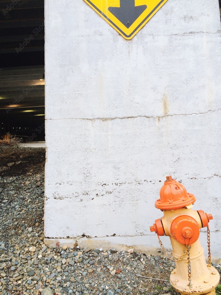 Fire Hydrant Against Wall By Tunnel Stock Photo | Adobe Stock