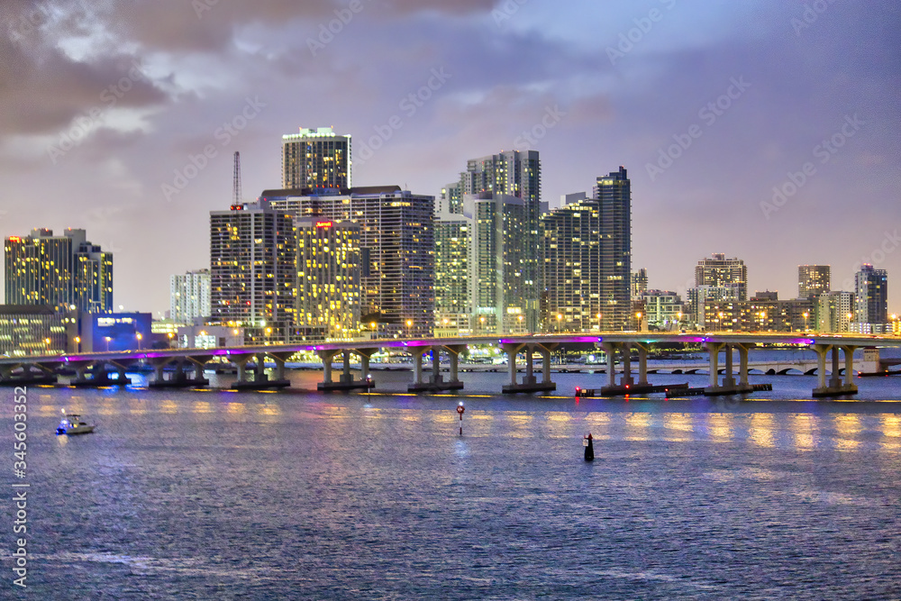 Lights of Port Boulevard Bridge in Miami with city night skyline ...