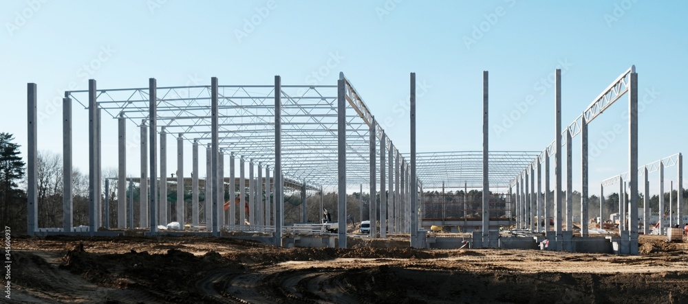 Construction site outside city, on edge of forest - concrete and steel ...