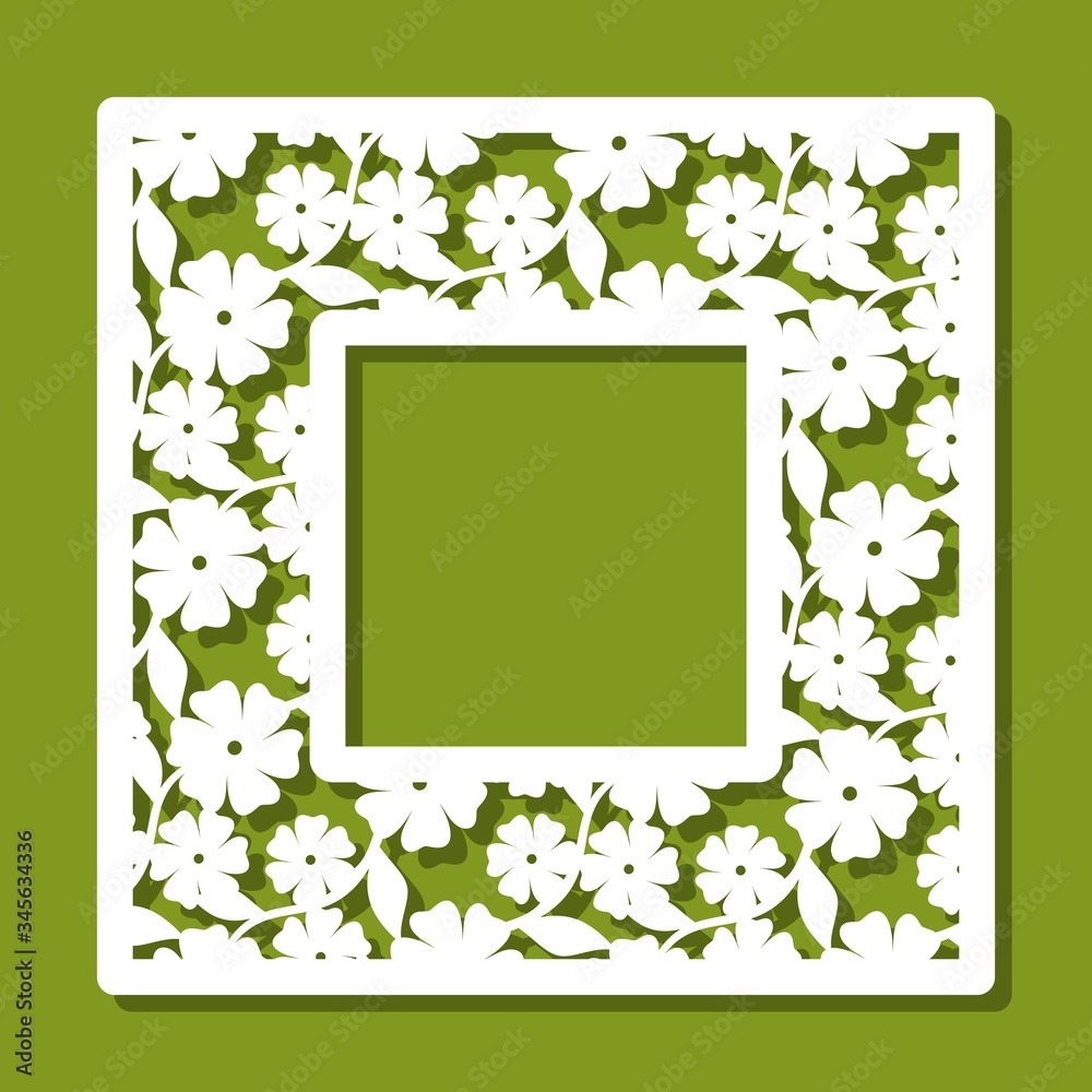 Square photo frame with floral pattern. White object on a green ...