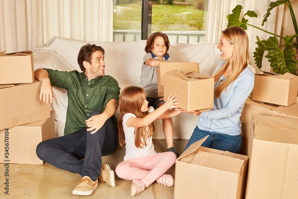 Family moving between moving boxes Stock Photo | Adobe Stock