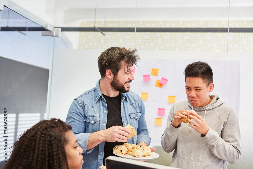 Team employees take a break at a snack Stock Photo | Adobe Stock