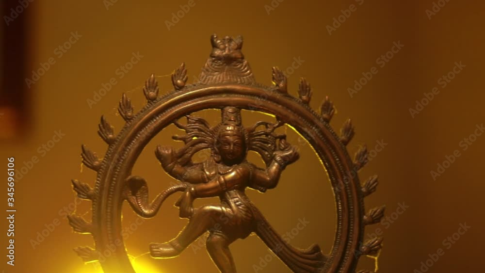 Traditional Indian statue of the dancing Shiva on the altar in the ...