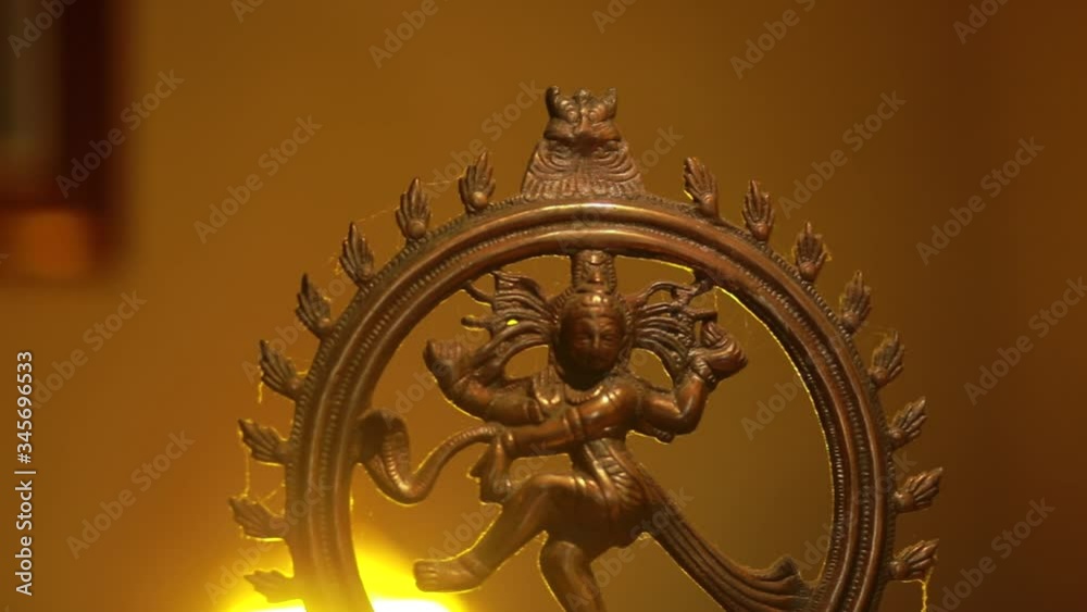 Traditional Indian statue of the dancing Shiva on the altar in the ...