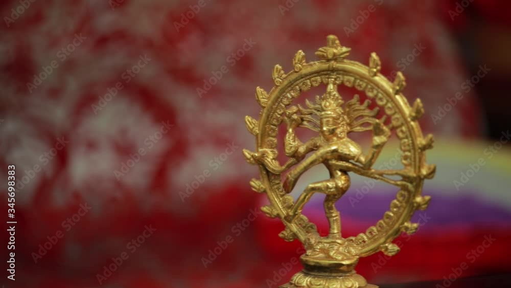 Traditional Indian statue of the dancing Shiva on the altar in the ...