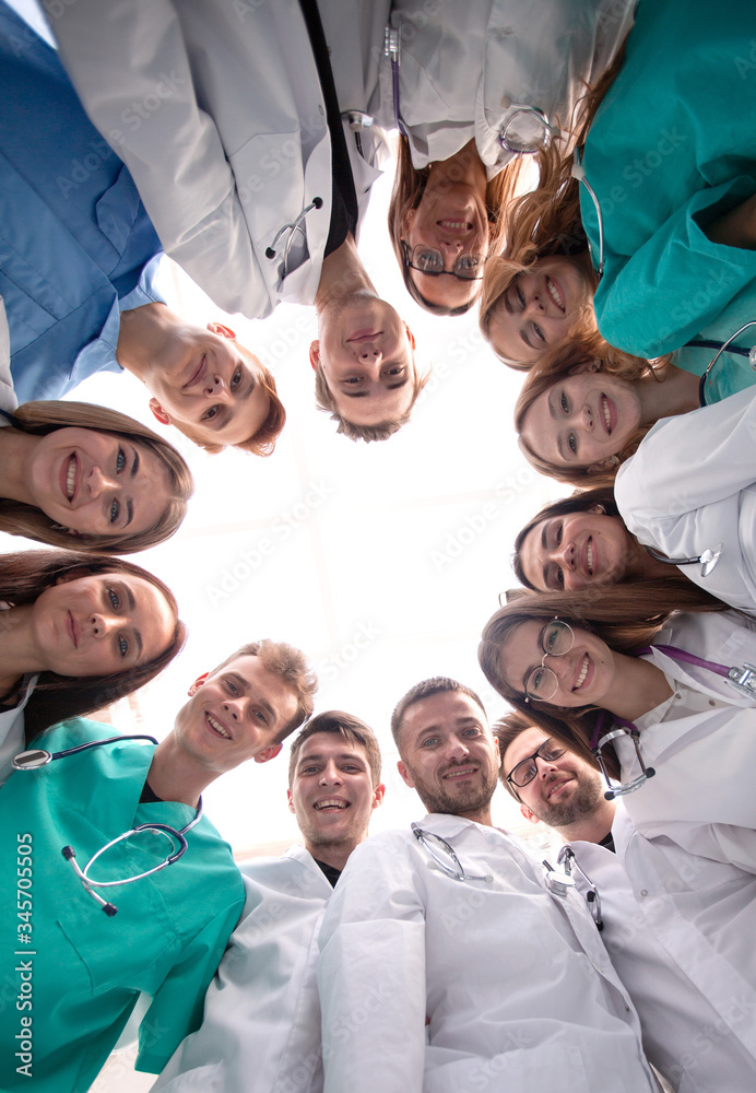 group of successful doctors standing in a circle Stock Photo | Adobe Stock