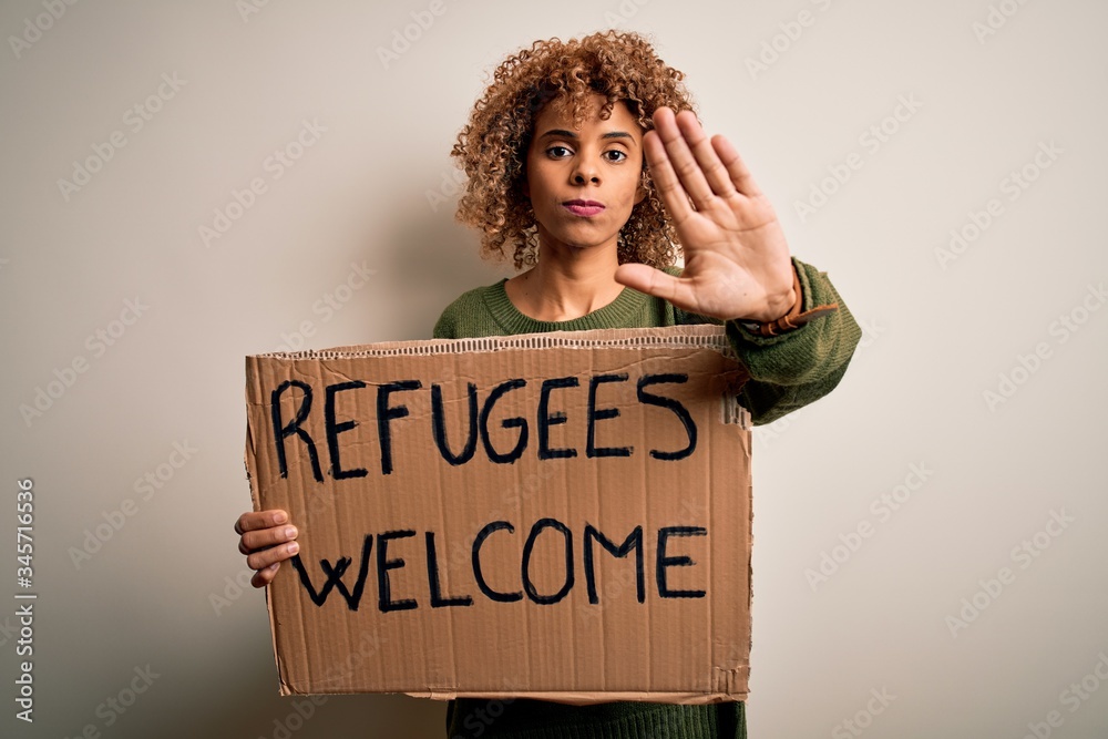 African american woman asking for immigration holding banner with ...