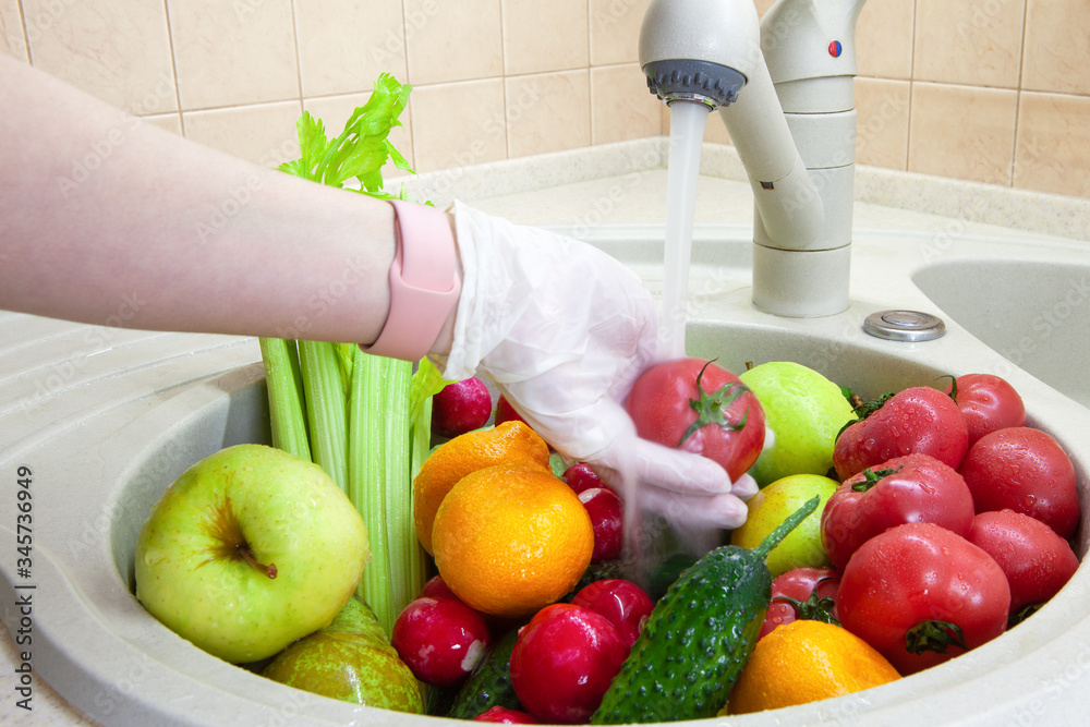 Washing fruits and vegetables after shopping from grocery store during ...