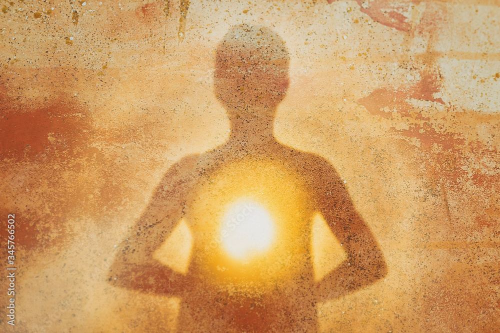 Female silhouette radiating light from within a spiritual heart opening ...