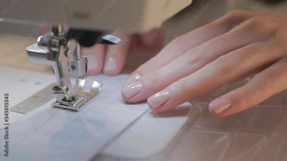 Close-up slow motion video of work of the master seamstress and needle ...