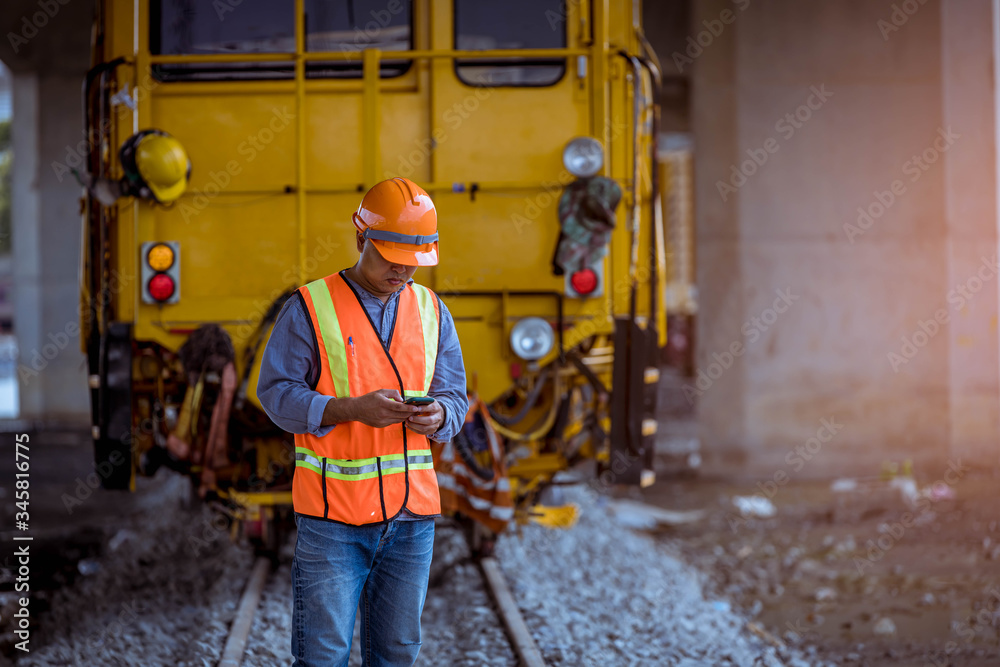 A Engineer under inspection checking head train and railway switch and ...