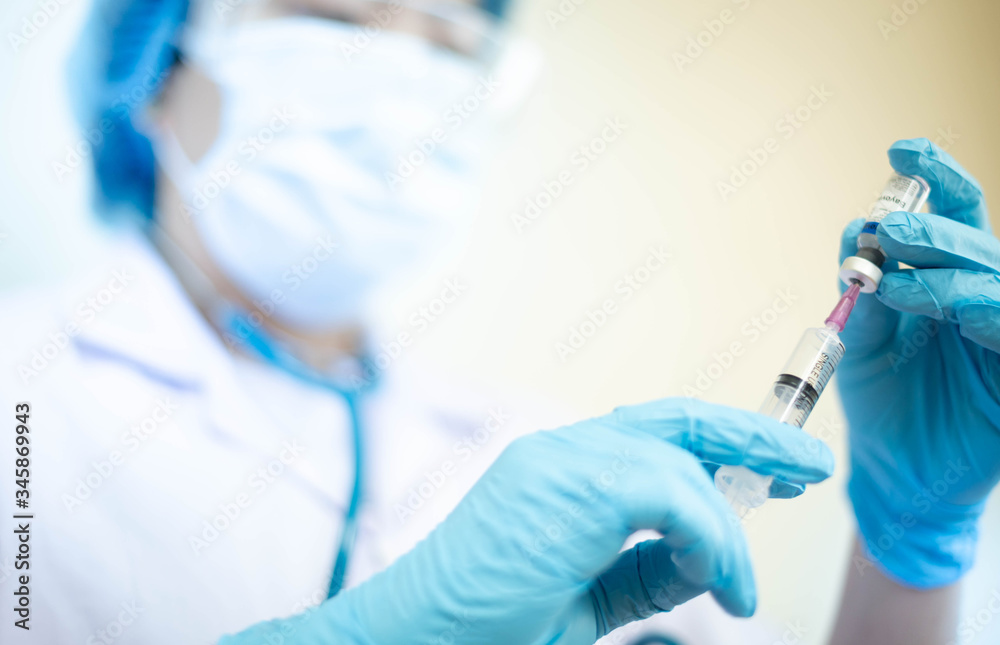 Syringe medical injection in hand holding with medicine dose ...