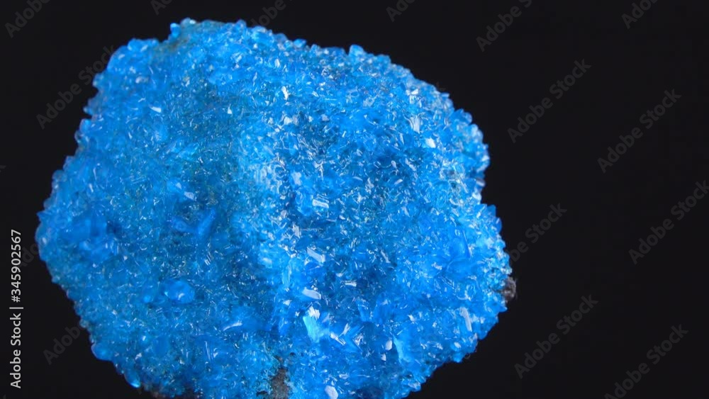 Blue Covelline or Covellite Crystals slowly rotates on a black ...