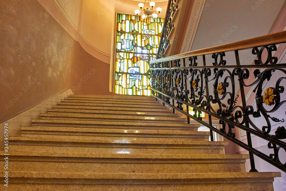 Staircase in the old house with stained glass window on top Stock Photo ...