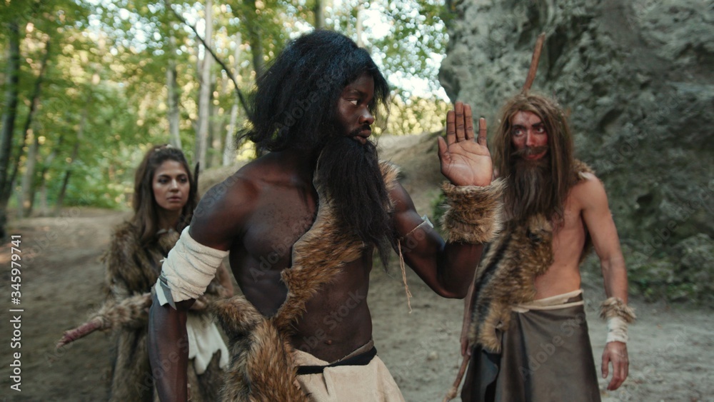 Neanderthal african family of hunter-gatherers staying in group hunting ...