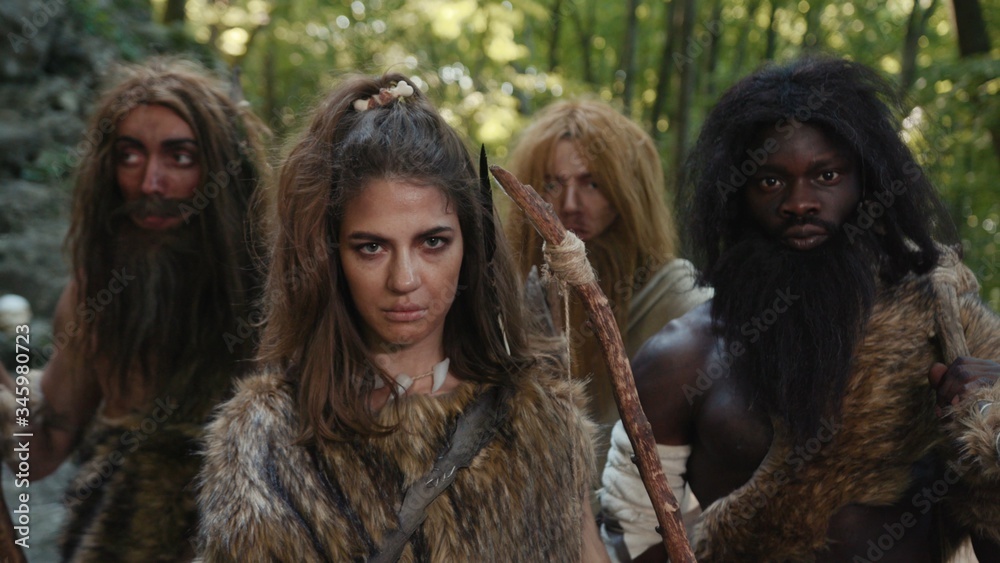 Primitive aboriginal tribe with female archer leader looking ...