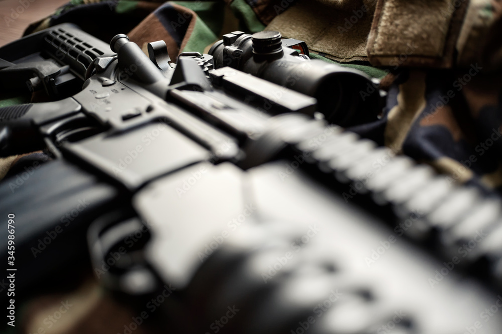 Military still life: AR15 assault rifle with optical sight and US Army ...