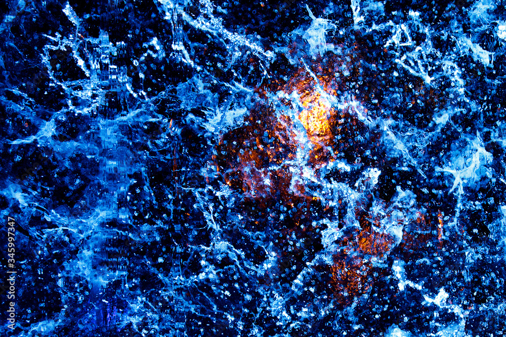 Transparent ice with abstract patterns, texture backlit with blue light ...